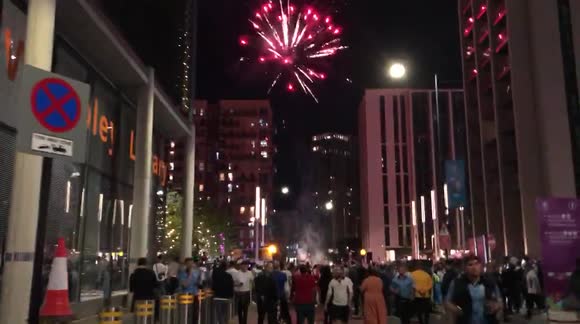 England fans outside Wembley Staidum let off fireworks to celebrate win ...