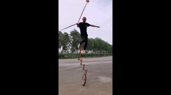 Chinese acrobat shows off incredible skills while riding a unicycle ...