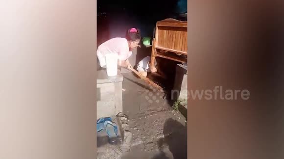 Neighbours rescue old woman from chest-deep flood during Typhoon Conson ...