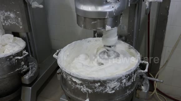 Palestinian workers prepare the vanilla candy known as "Ras El-abed or ...