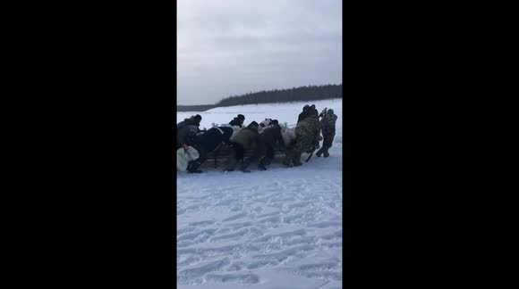 Fishermen helpless as they watch sledge loaded with fish fall through ...