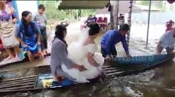 Couple gets married during floods in Indonesia - Buy, Sell or Upload ...