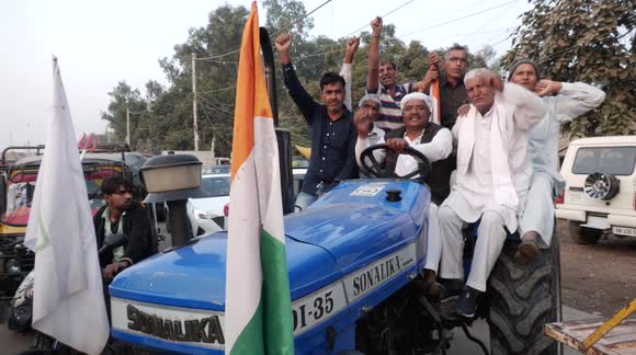 Indian farmers celebrate year anniversary of protest with tractor rally ...