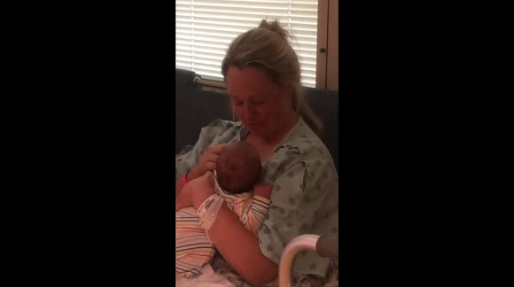 Emotional mum meets week-old baby for first time after 'explosion in ...