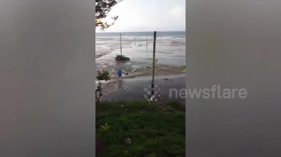 Tsunami flood sweeps away vehicle in Fiji after undersea volcano erupts ...