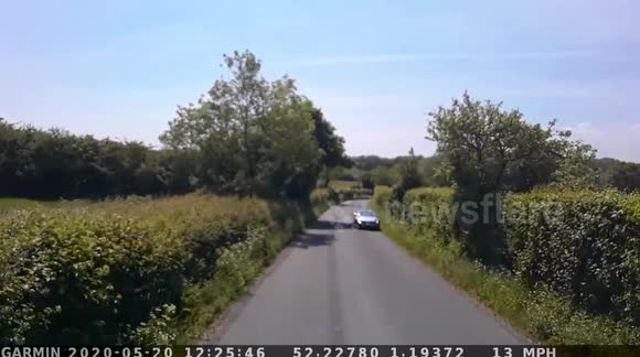 Mother and two young children around blind bend in narrow road. Reasons ...