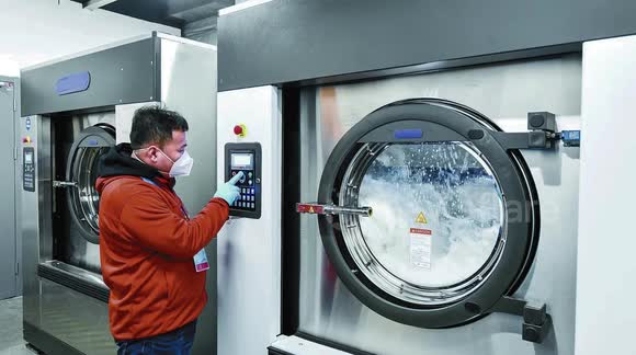 Giant washing machines are used to wash 100 jackets once during Winter ...