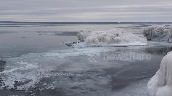 Ice cracking lake, as the ice sheet pushes onto the shoreline of Lake ...