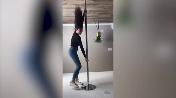 Canadian pole performer holds herself upside down and dances on the ...