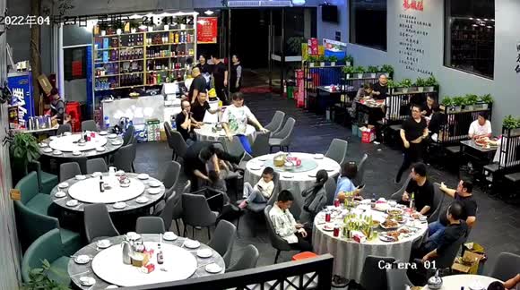 Quick-thinking waiter catches boy falling off chair in Chinese ...