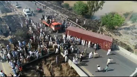 Anti-government protesters push shipping containers out of the way of ...