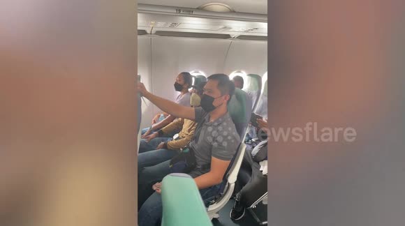 Plane's faulty aircon leaves passengers sweating 'like in a sauna' in ...