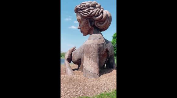 Breathtaking wooden sculpture of a woman ripping her chest to reveal ...