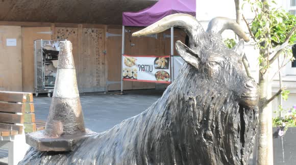 Statue of bronze goat wearing traffic cone permanently installed in ...