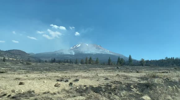 A forest fire on the flanks of Mt. Shasta, California, during wildfire ...
