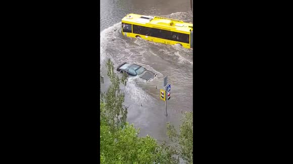 Yellow submarine? Bus makes way through flooded street in Belarus - Buy ...