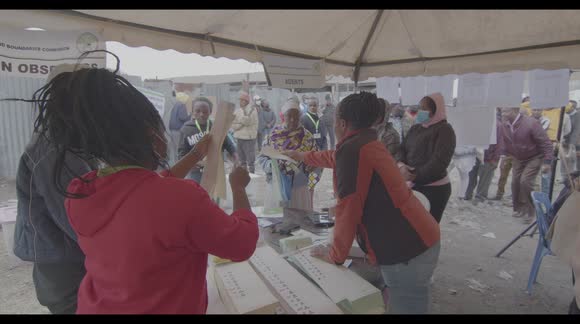 Kenyan Voter Registering and Collecting Voting Materials for the 2022 ...