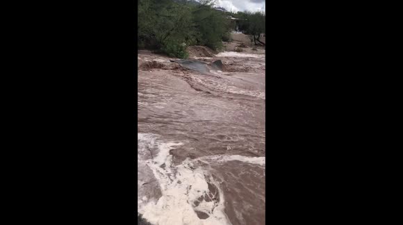 Flash flood in Tucson Arizona from monsoon storm rain washes out and ...