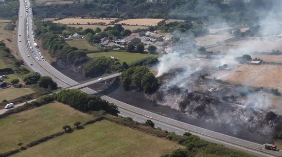 Fire closes A30 main road in Redruth, Cornwall. Firefighters and huge ...