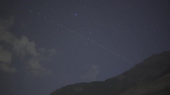 Train of Starlink satellites light up night sky in Swiss Alps - Buy ...