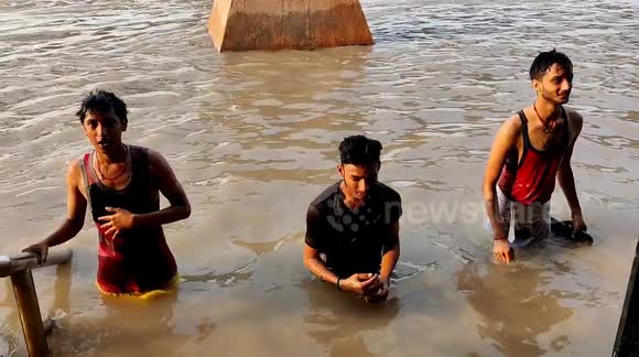 Locals wade through knee-deep water as Ganges' rises to dangerous ...