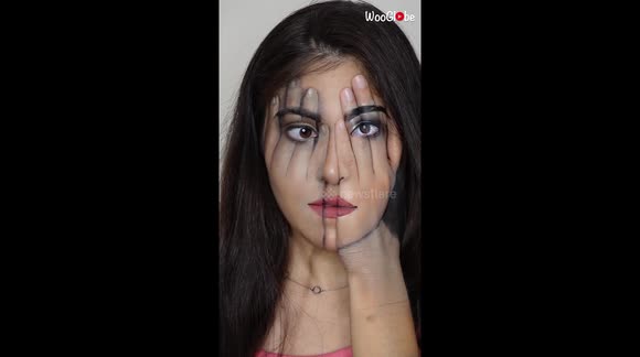 Artist paints her hand on face and face on hand as part of a MIND ...
