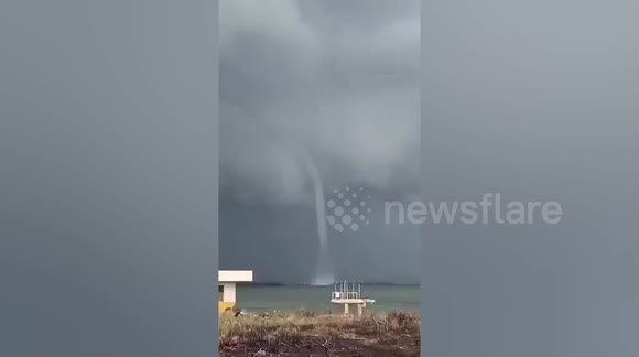 Large waterspout forms terrifyingly close to beach in the Philippines ...