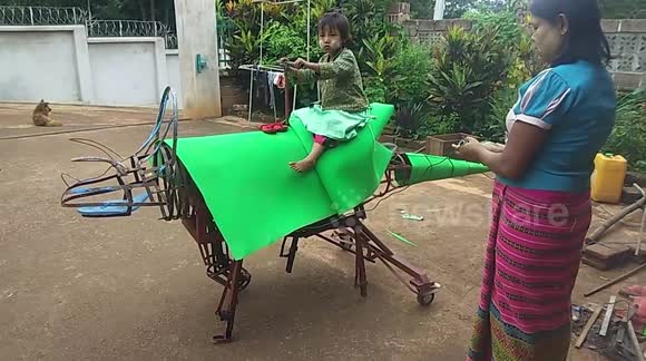 Burmese blacksmith builds moving triceratops robot in his workshop ...