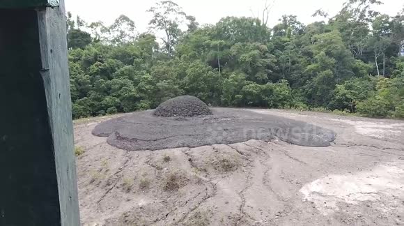 Rare mud volcano erupts spewing sludge onto surrounding grass in ...