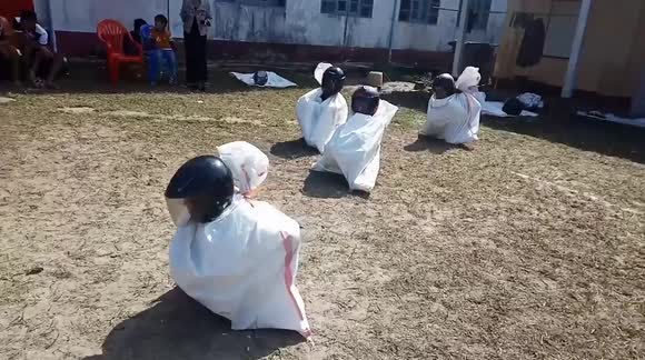 Students bounce across field in hilarious gunny sack race in Myanmar ...
