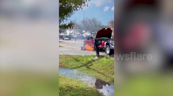 Bizarre moment a Tesla randomly catches fire after water damage during ...