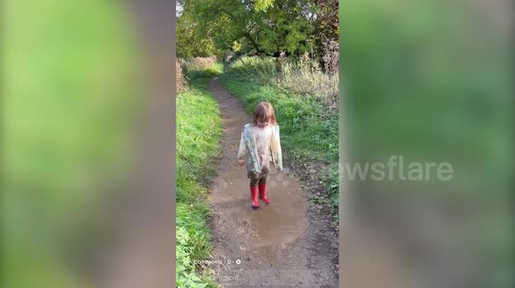Three-year-old Peppa Pig fan is crowned the winner of the annual World Puddle Jumping ...