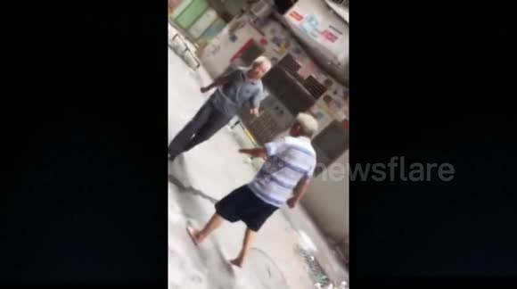 Two elderly men start a comical fight on the street - Buy, Sell or ...