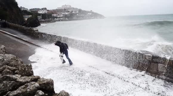 Surfers and spectators get a soaking Porth Beach in Cornwall amid ...