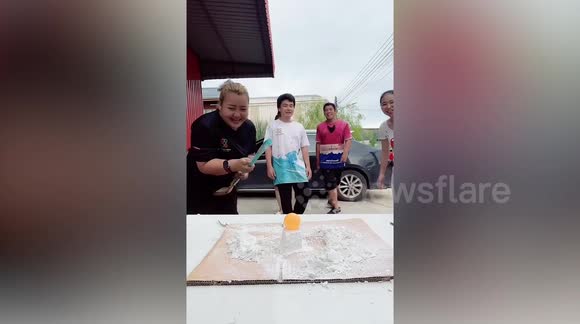 Family play hilarious Jenga-style party game with ping pong ball and ...