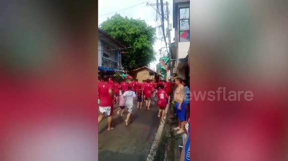 Residents hold wooden hut carrying race during festival in the ...
