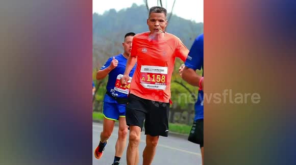 Chinese runner goes viral for chain-smoking his way through marathon ...