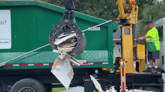 Crane operator pickups debris with the skill of a veteran - making it ...