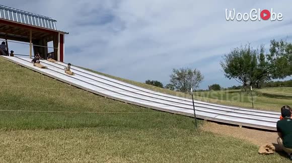 Eager boy finds potato sack slide to be a bit too adventurous for his ...