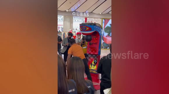 Muay Thai boxer smashes punch bag arcade game at shopping mall - Buy ...