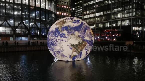 Earth seen floating around in waters of Canary Wharf during Winter ...