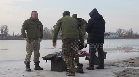 Ukrainian soldiers leave frontline to dive in icy water on Feast of ...