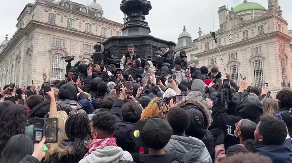 UK Rapper, Digga D, films a music video in Piccadilly Circus with his ...