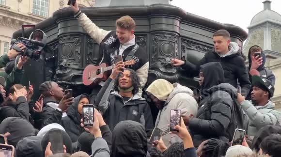 UK Rapper, Digga D, films a music video in Piccadilly Circus with his ...