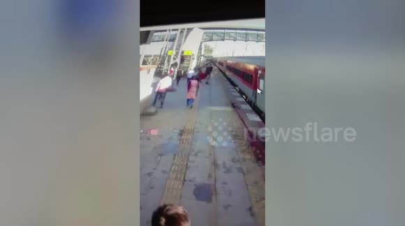 Alert Cop Saves Life Of A Woman Who Slipped While Boarding Moving Train In Western India Buy 