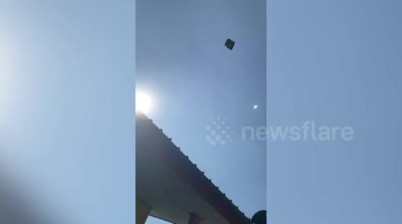 It's a UFO! Hilarious moment mystery flying tent lands in family's back ...