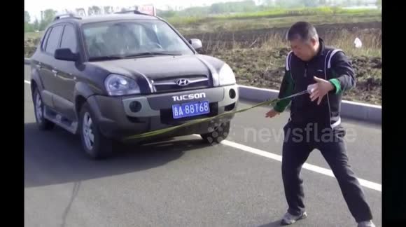 Kung fu doctor uses one hand to pull a car - Buy, Sell or Upload Video ...
