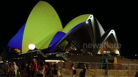 Sydney Opera House is lit up on first anniversary of invasion of ...