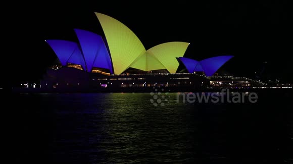 Sydney Opera House is lit up on first anniversary of the invasion of ...