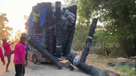 Hundreds of buckets fall from the back of overloaded pickup truck - Buy ...